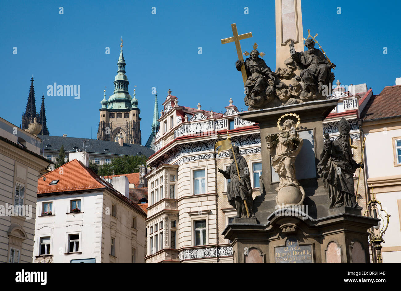 Prague - baroque column of Holy Trinity and tower of st. Vitus ...