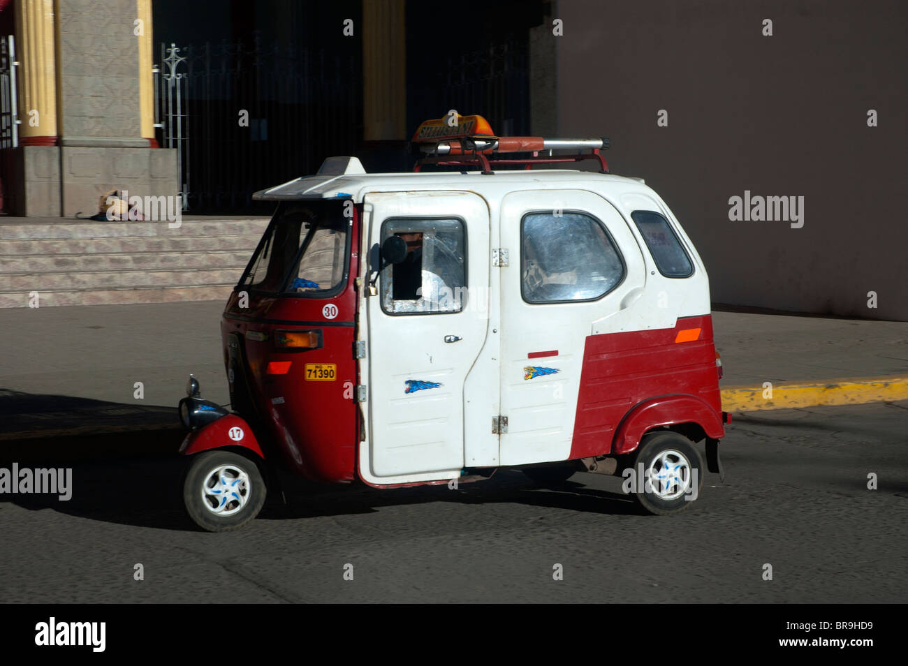 Converted motorcycle type of taxi, public transport, on the street at ...