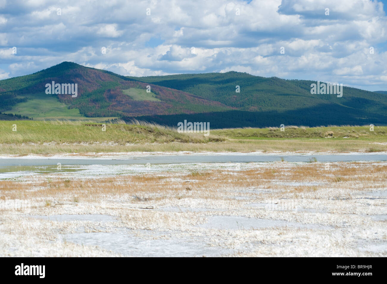 a brine lake and mountains in the background Stock Photo - Alamy