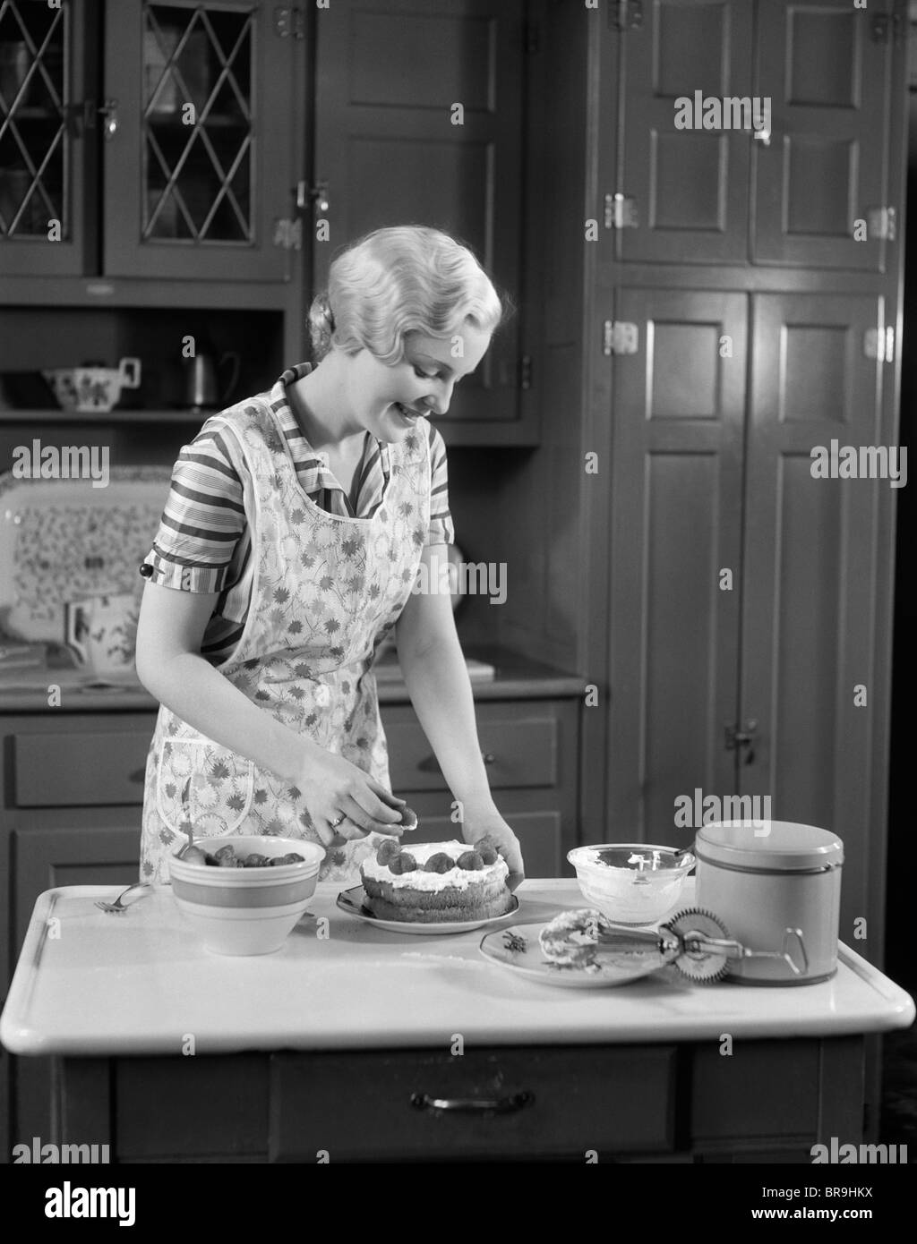 1930s WOMAN IN KITCHEN MAKING STRAWBERRY SHORTCAKE Stock Photo - Alamy