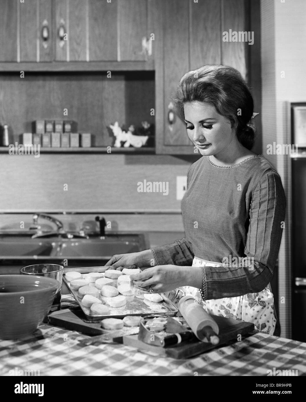 1960s WOMAN HOUSEWIFE BAKING BISCUITS IN KITCHEN Stock Photo - Alamy