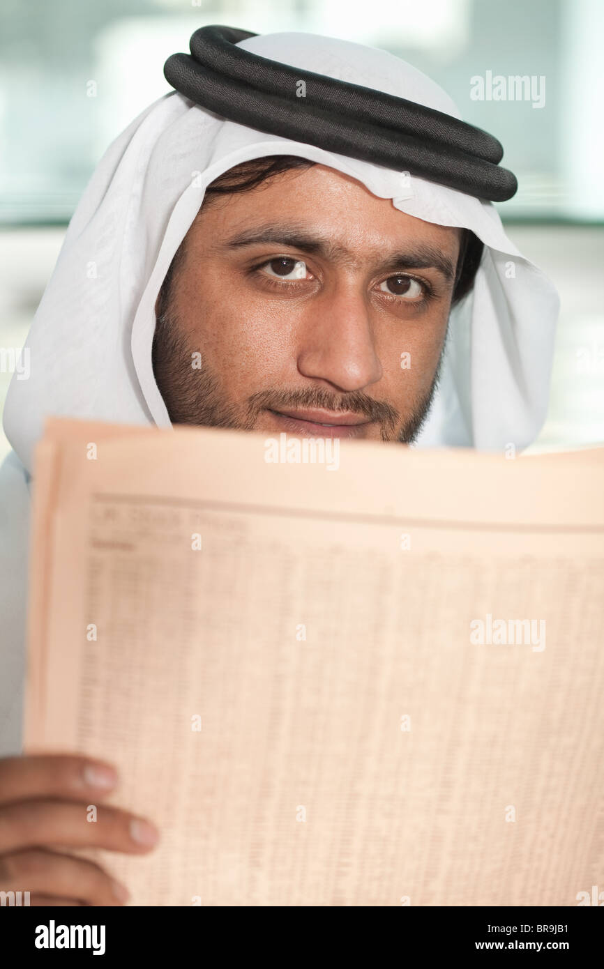 Middle eastern businessman with financial newspaper Stock Photo - Alamy