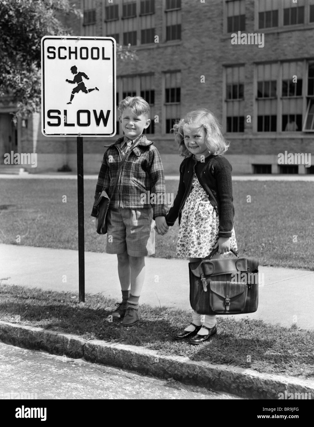 Boy girl hold hands Black and White Stock Photos & Images - Alamy