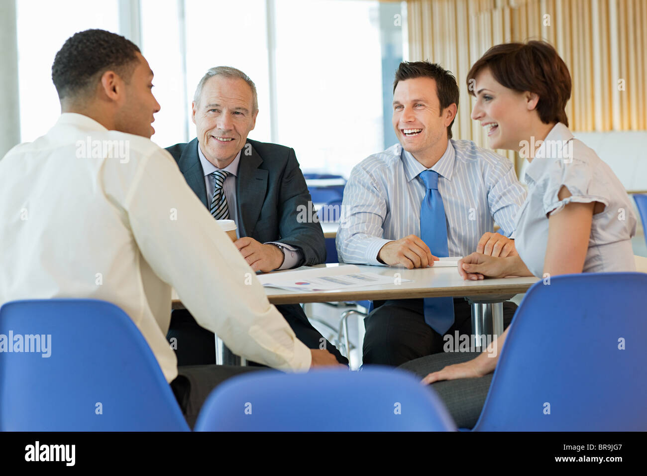 Group four smiling businesspeople hi-res stock photography and images ...