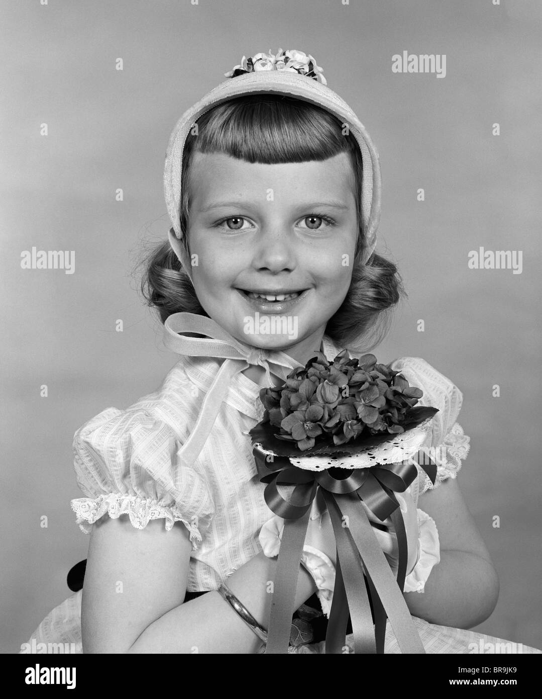 Children with flowers 1950s hi-res stock photography and images - Alamy