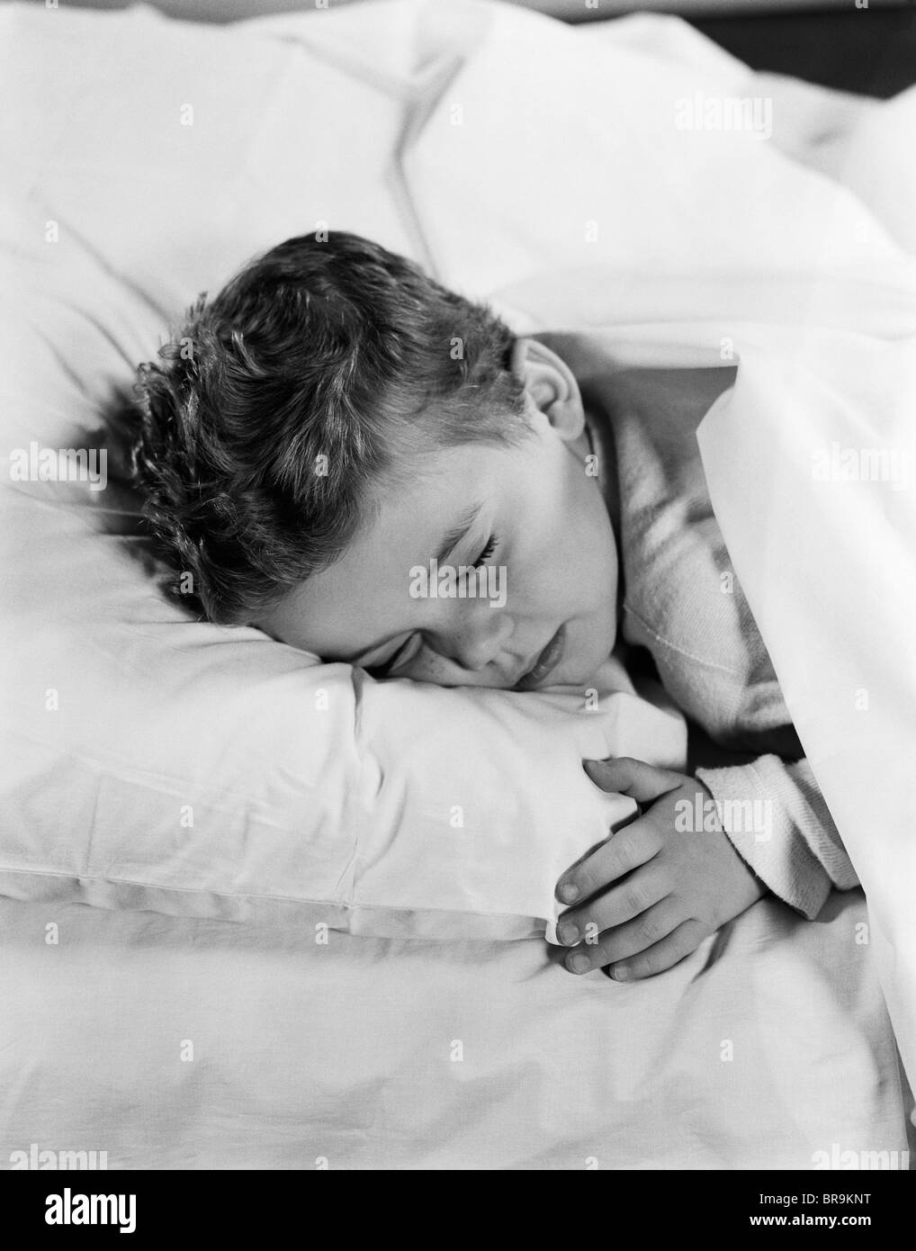 1950s CHILD LITTLE BOY SLEEPING IN BED Stock Photo - Alamy