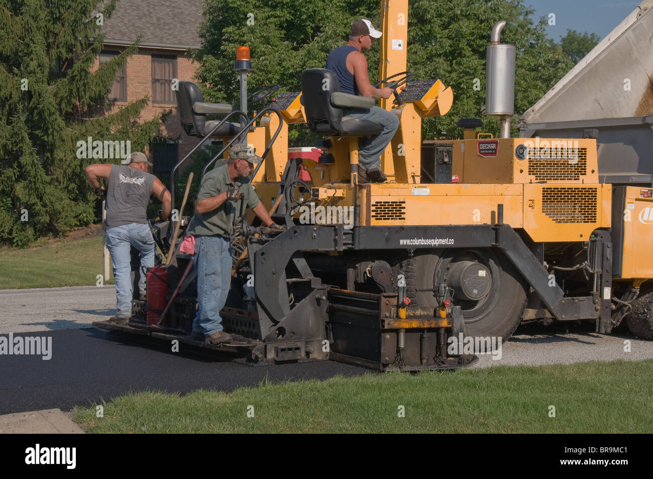 Paving street in residential area . Ohio USA Stock Photo - Alamy