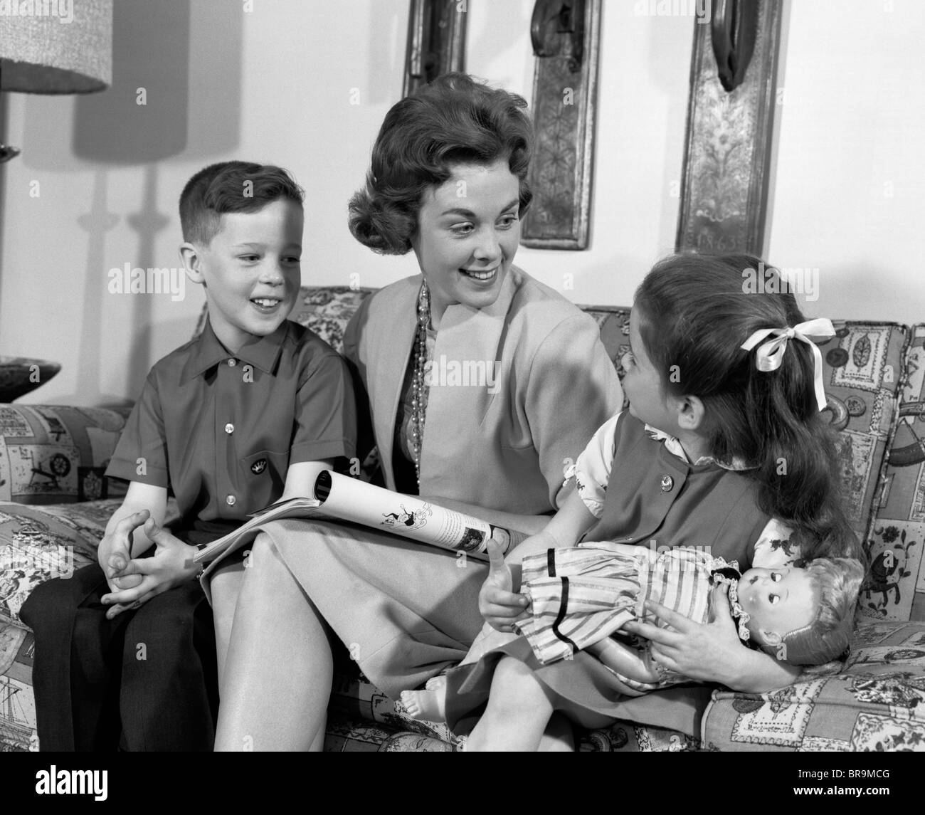 1960s MOTHER SITTING ON COUCH WITH SON AND DAUGHTER Stock Photo - Alamy