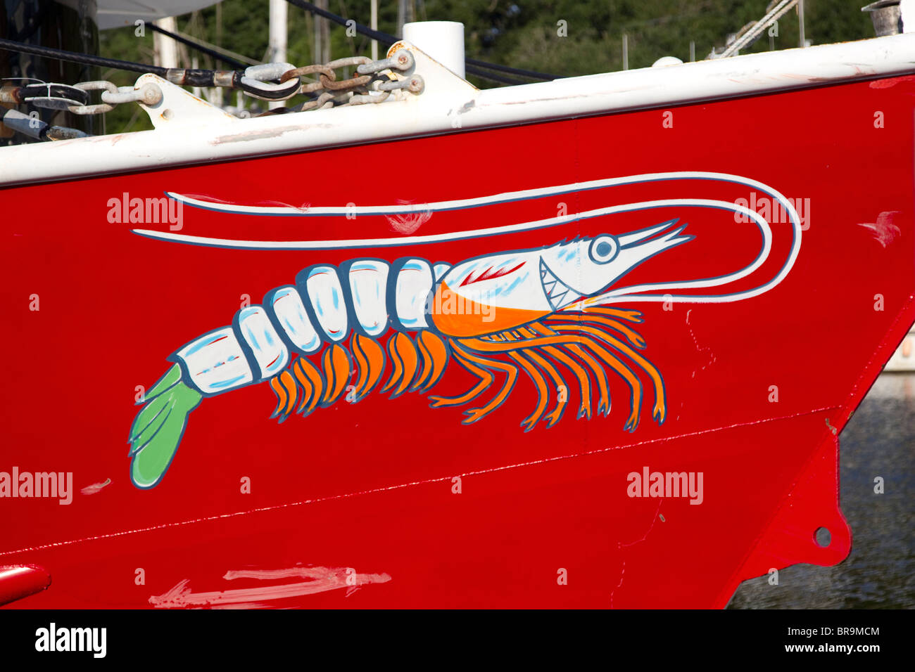 Close up of red shrimp boat with painted shrimp on hull bow Stock Photo ...