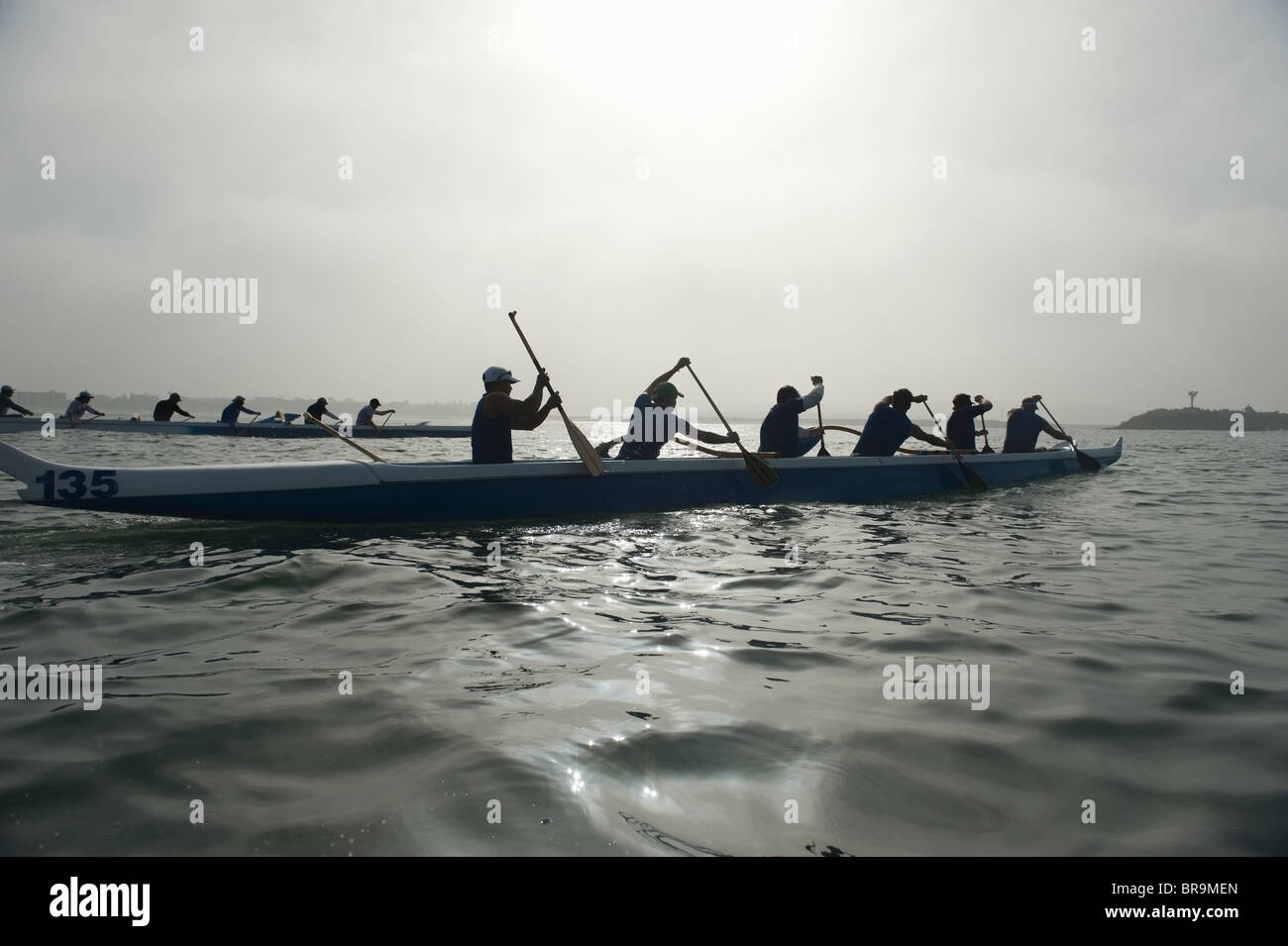 Outrigger canoeing team compete Stock Photo - Alamy
