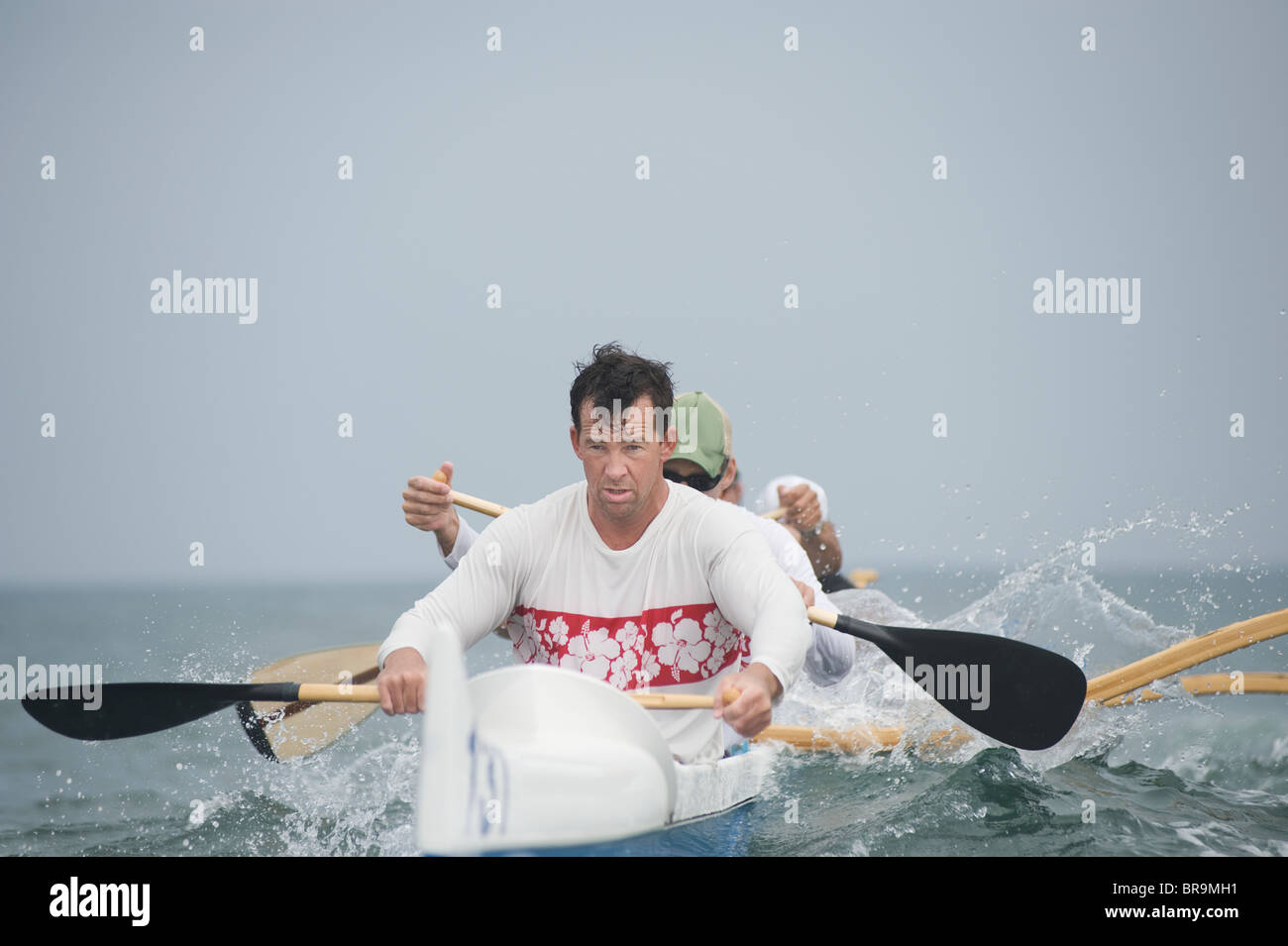 Man paddling on outrigger canoe hi-res stock photography and images - Alamy