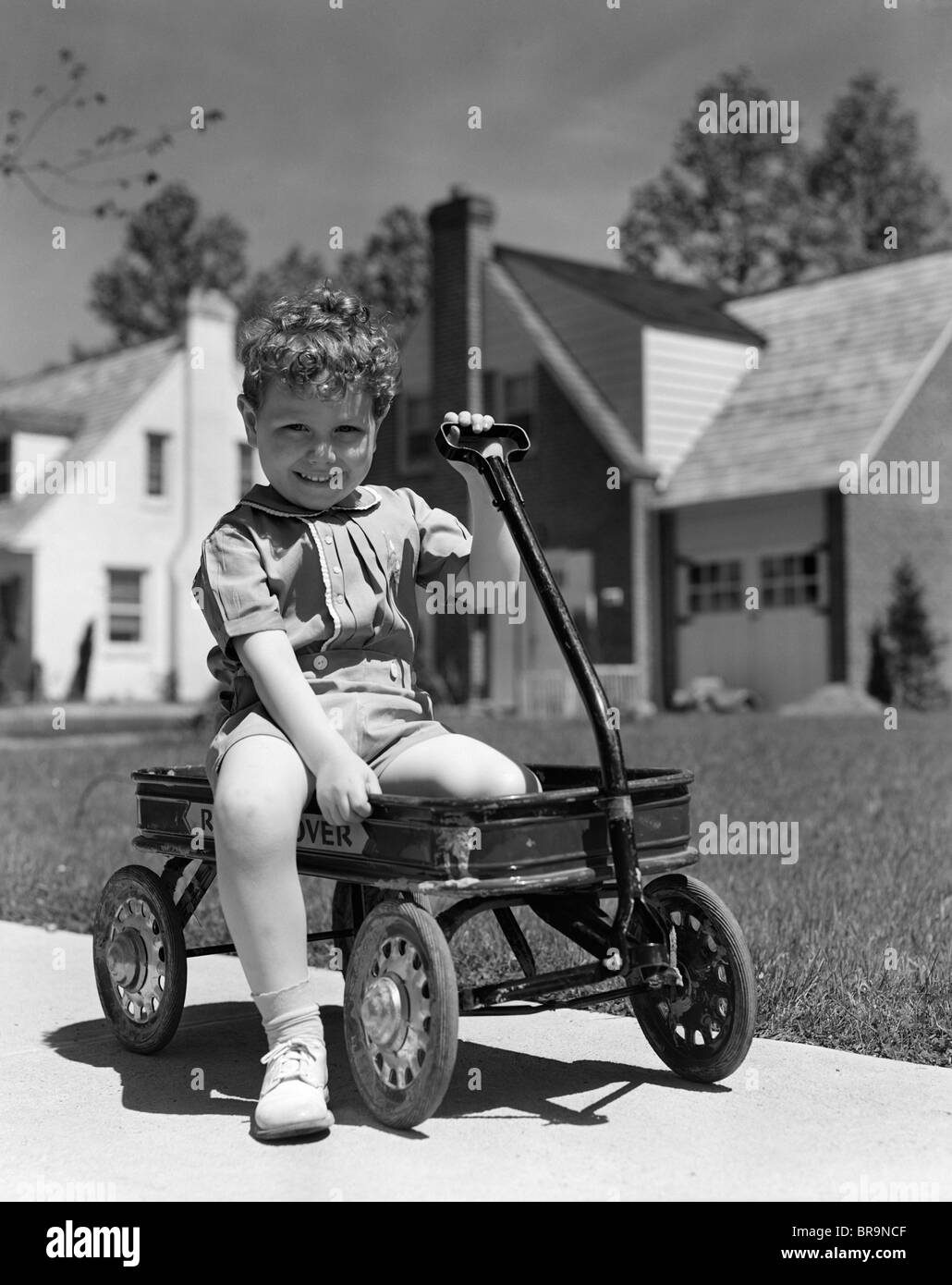 1940s SMILING BOY SITTING IN WAGON Stock Photo - Alamy