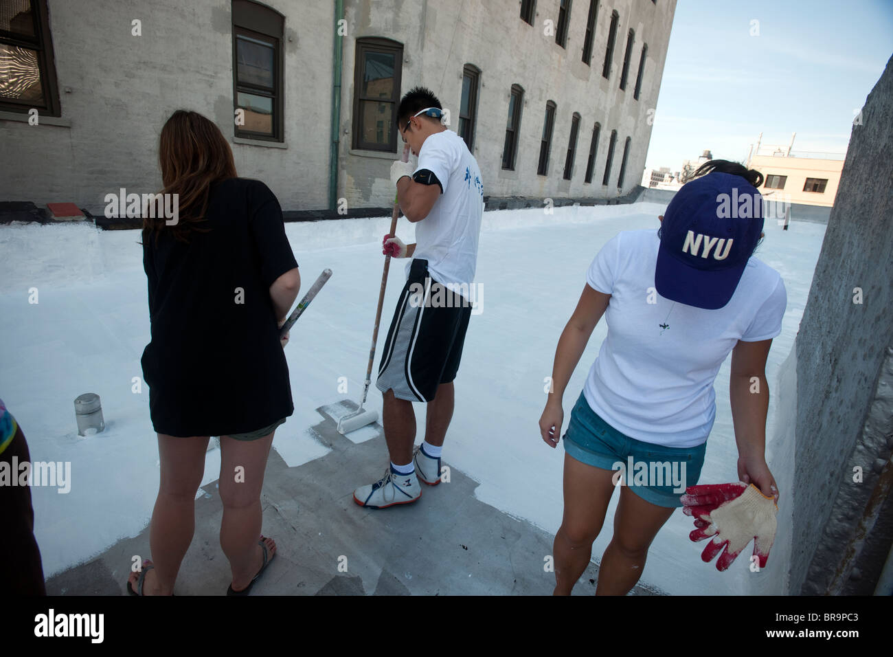 Volunteers paint the the roof of the Bowery Mission in New York with ...