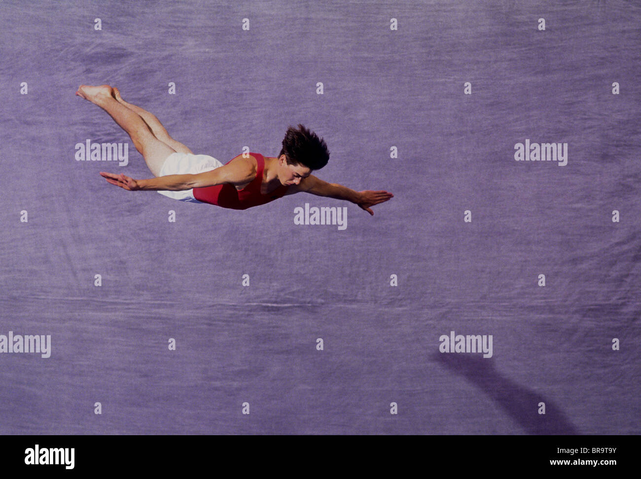 Male gymnast performing on the floor exercises Stock Photo - Alamy