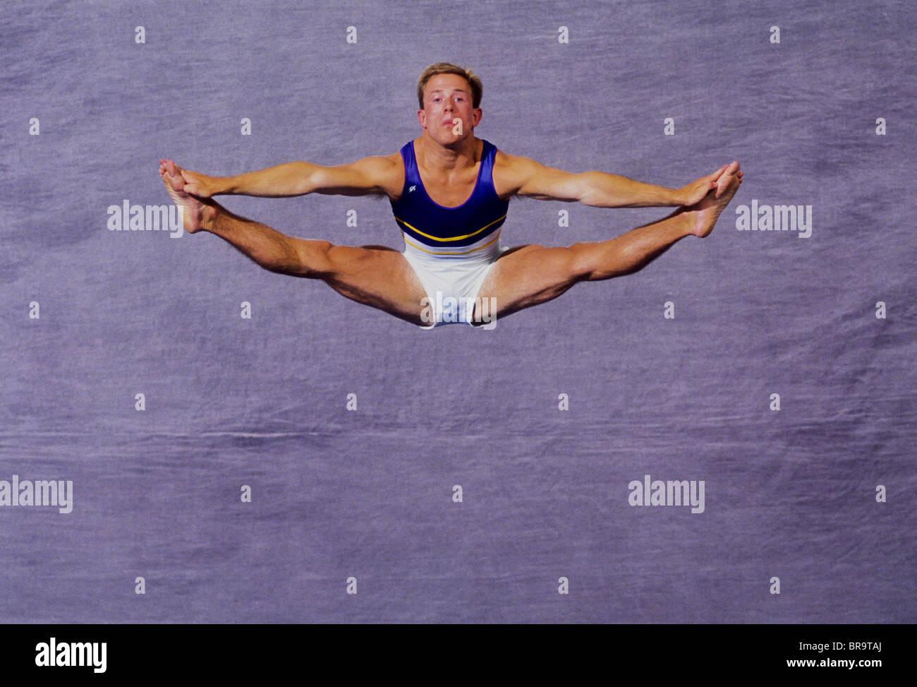 Male gymnast performing on the floor exercises Stock Photo - Alamy
