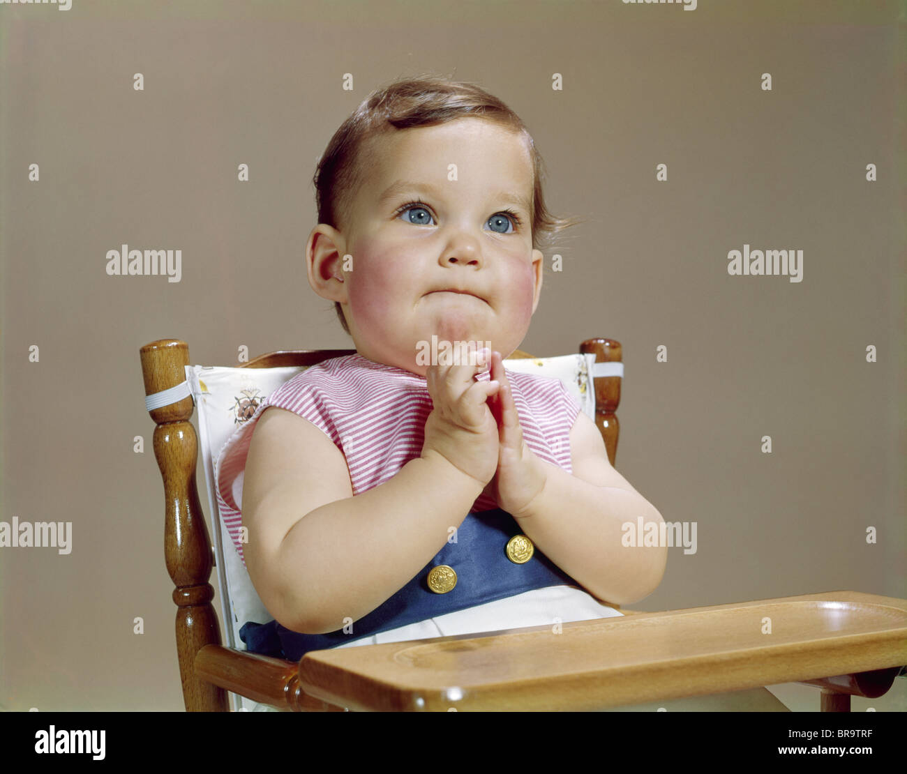 1960s BABY HANDS TOGETHER AT CHIN THINKING THOUGHTFUL FACIAL EXPRESSION ...