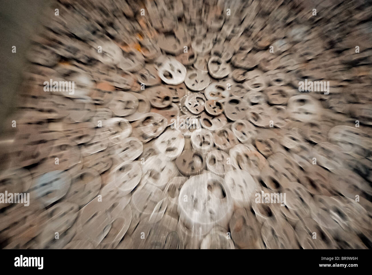 Shalechet - memory Void , cast steel ingots in the shape of faces ...