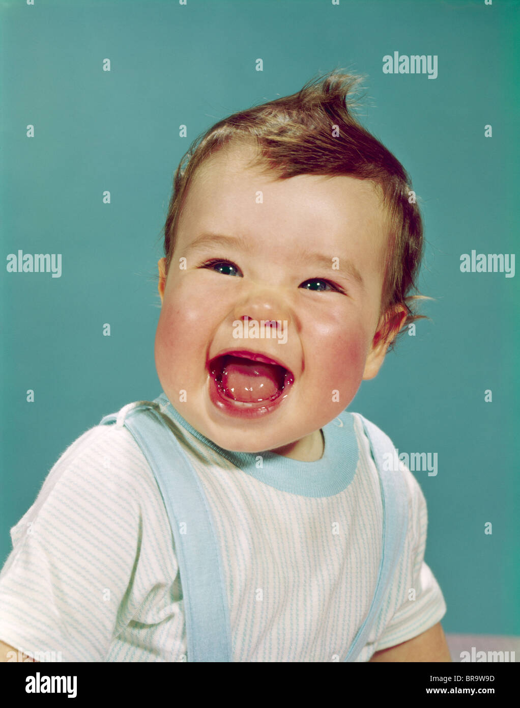 1960s HAPPY SMILING LAUGHING BABY WITH MOUTH WIDE OPEN Stock Photo - Alamy