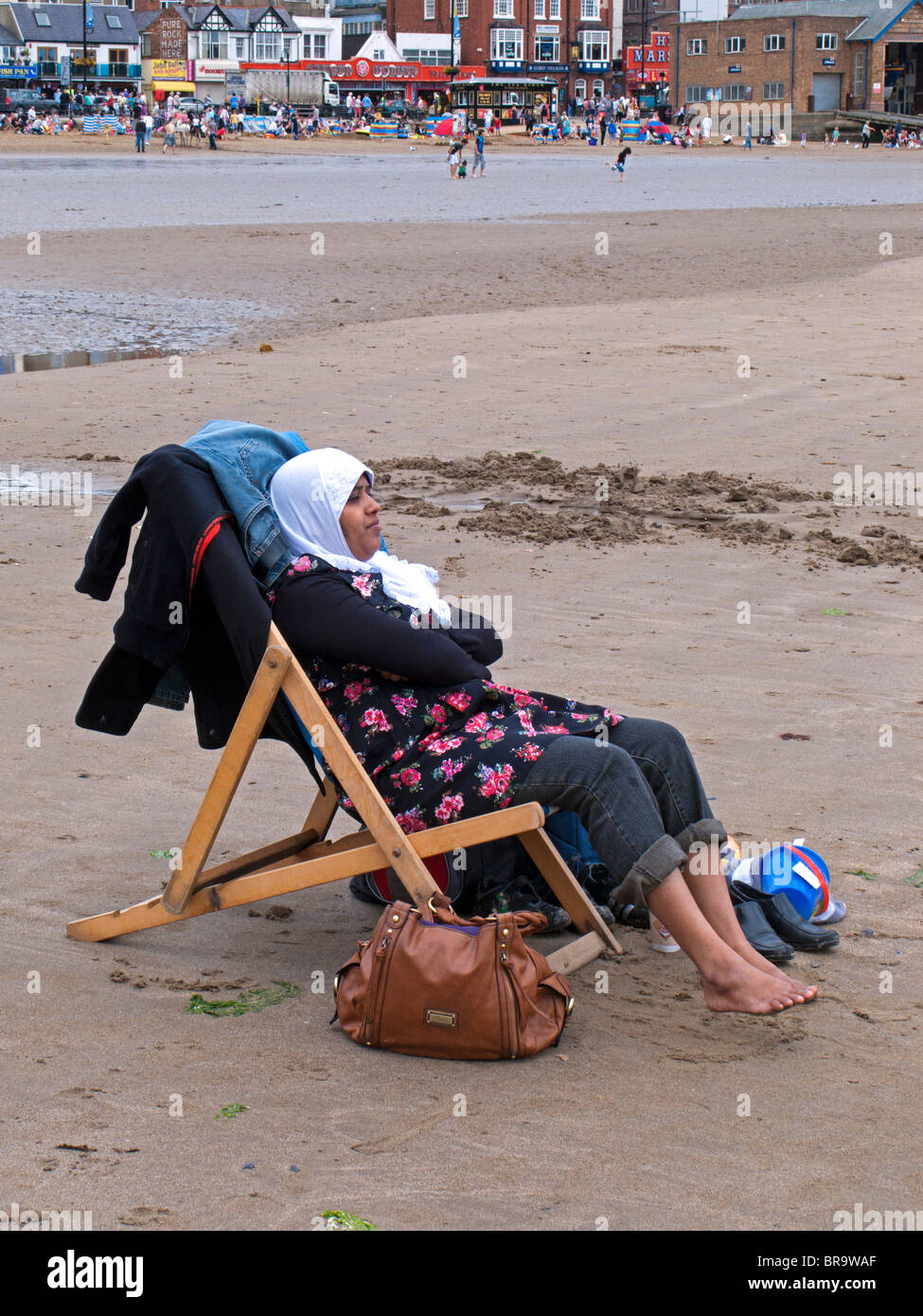 Holidaymaker relaxing on beach in Scarborough Stock Photo - Alamy