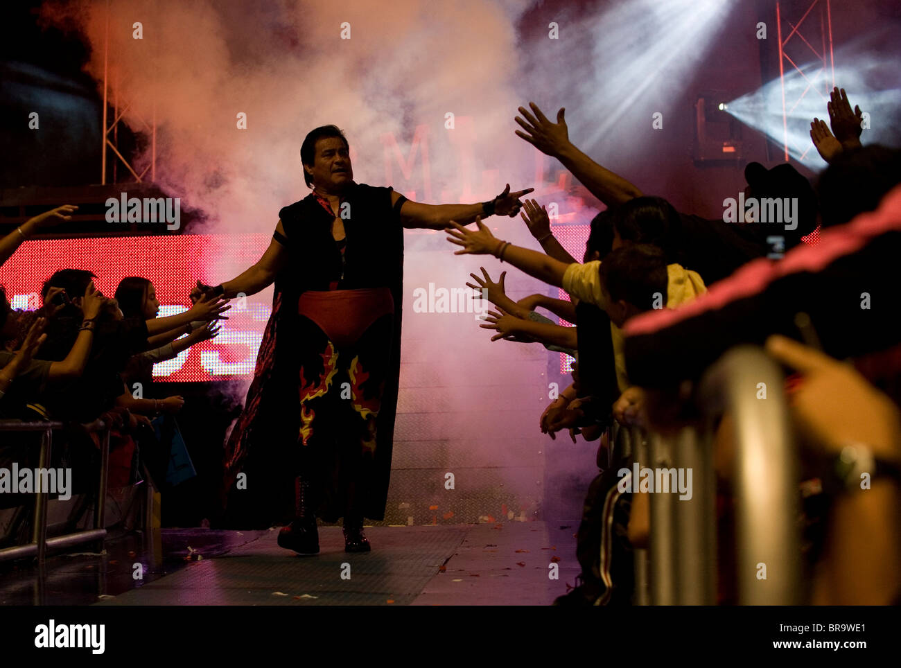 A wrestler greets fans at a Lucha Libre event in Arena Mexico Mexico ...
