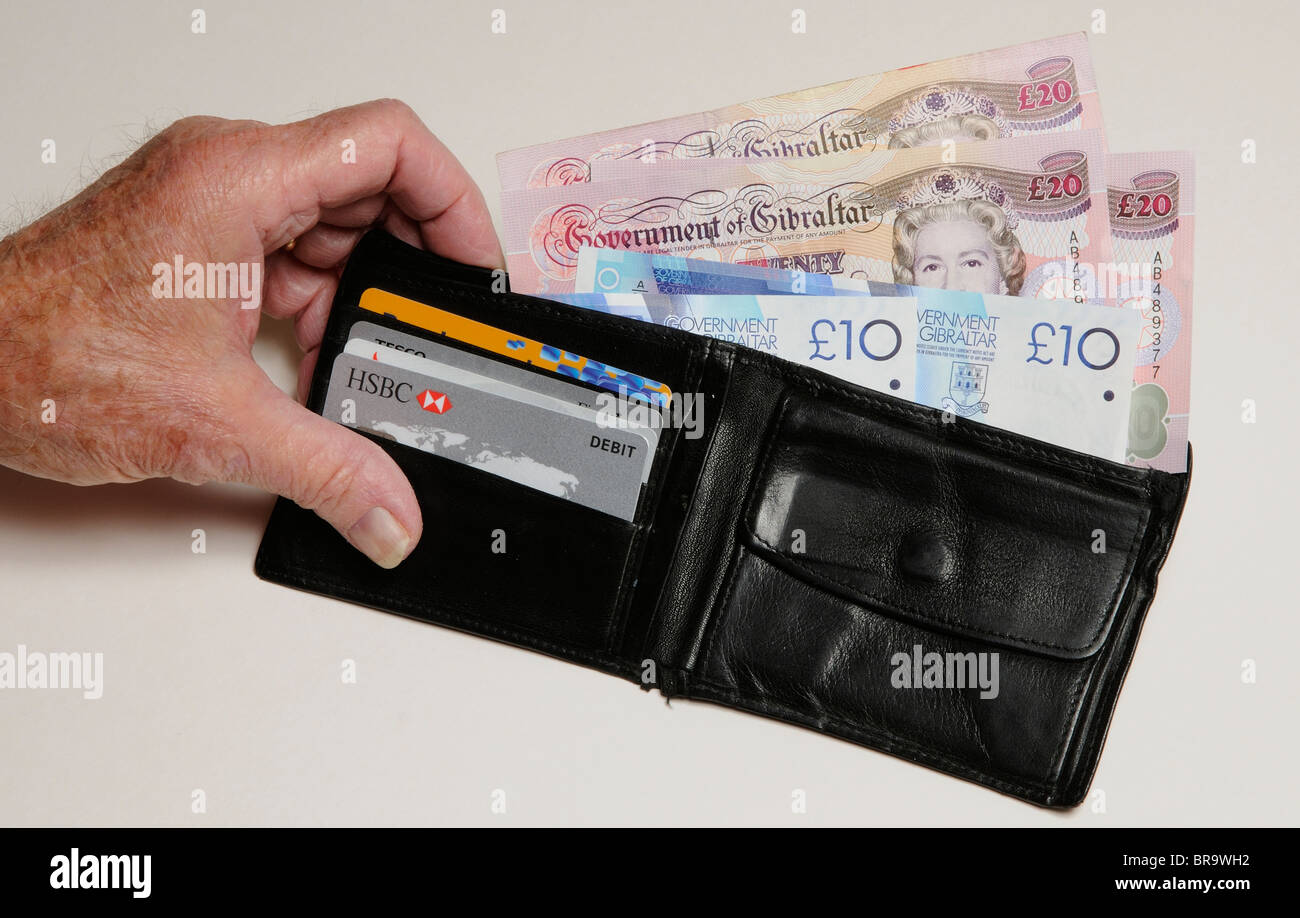 Government of Gibraltar ten and twenty pound notes in a man's wallet ...