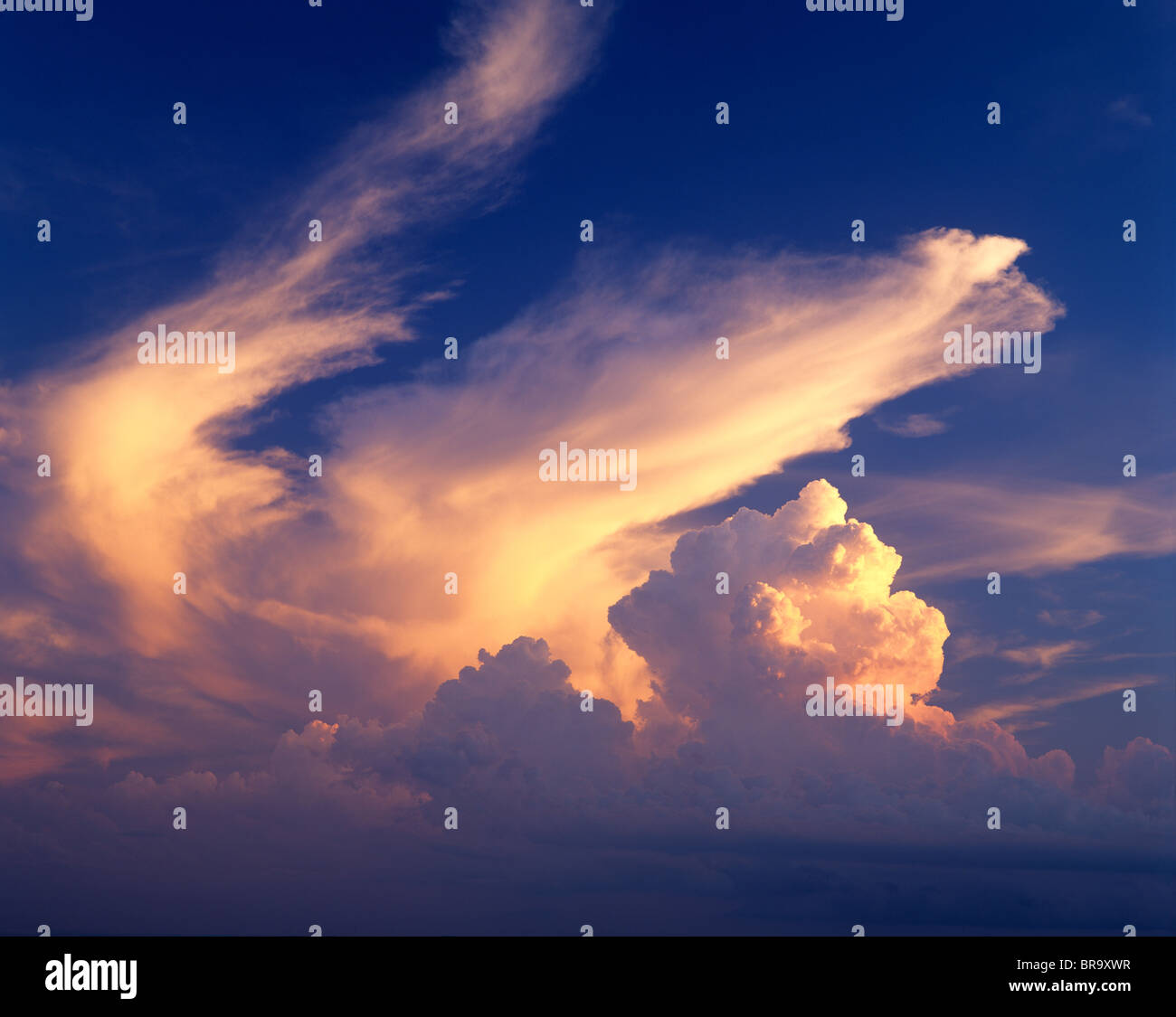 DRAMATIC CLOUDS REFLECTING SUNSET GLOW Stock Photo - Alamy
