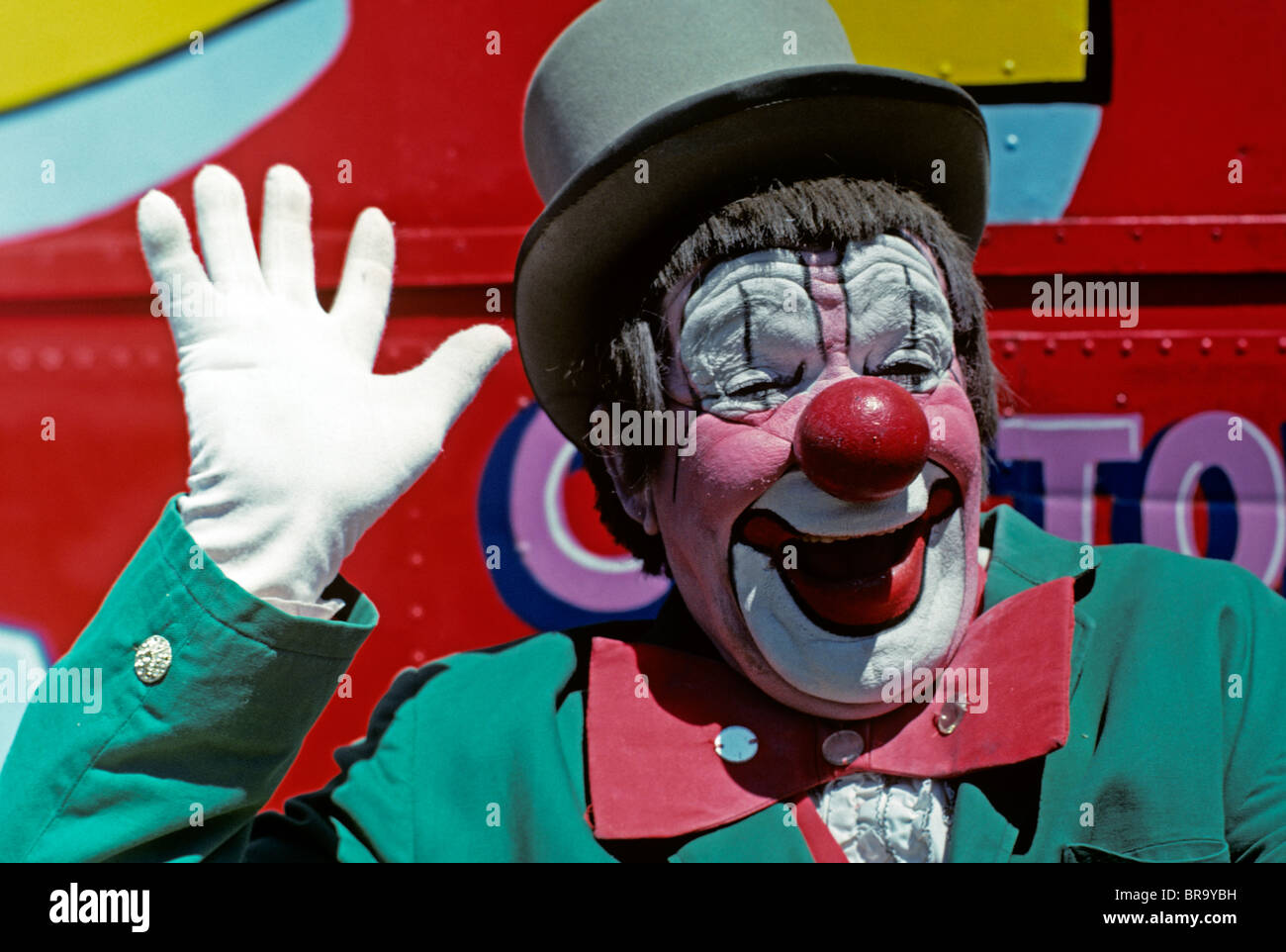 1970s SMILING CLOWN PINK FACE GREEN JACKET WAVING A WHITE GLOVED HAND ...