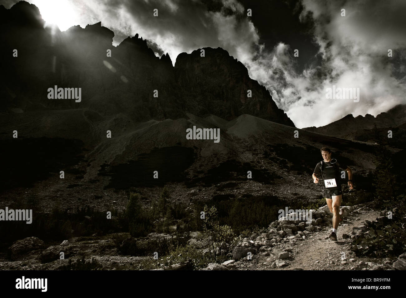 One runner on the mountain in the transalpine race in the Alps Europe ...