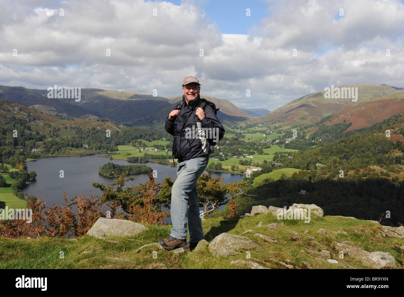 The photographer Simon Dack walking up Loughrigg Fell in the Lake ...