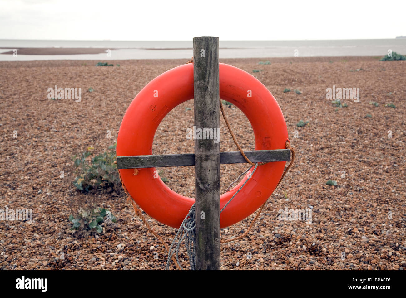 Red life saving ring Shingle Street beach, Suffolk, England Stock Photo ...
