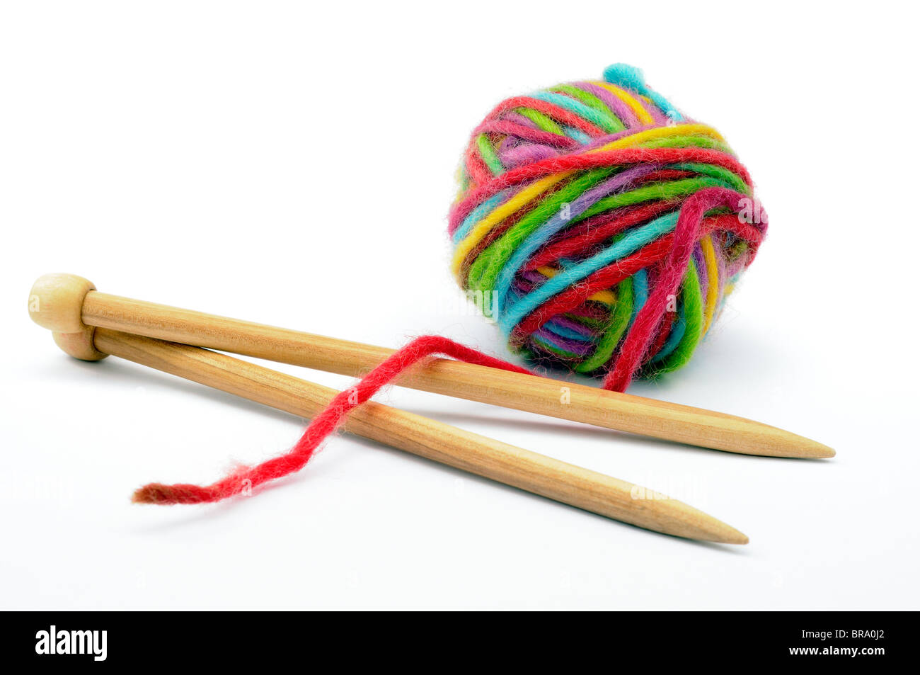 Multi colour ball of wool on white background Stock Photo - Alamy
