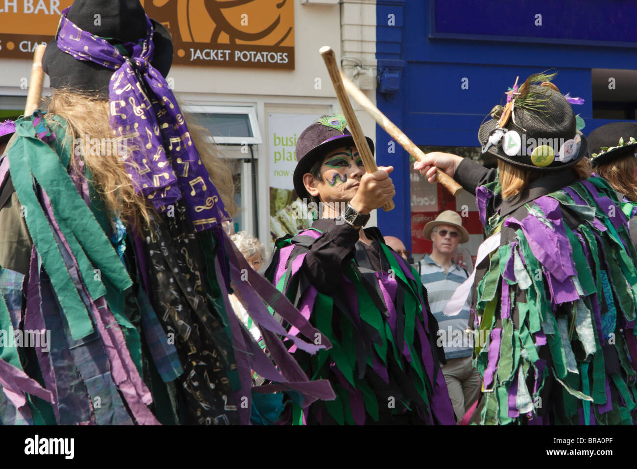 Members of the Wicket Brood Border Morris performing Border style dance ...