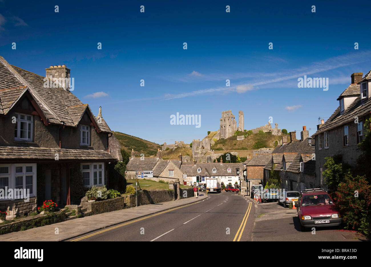 Traditional English village of Corfe, overlooked by Corfe Castle in ...