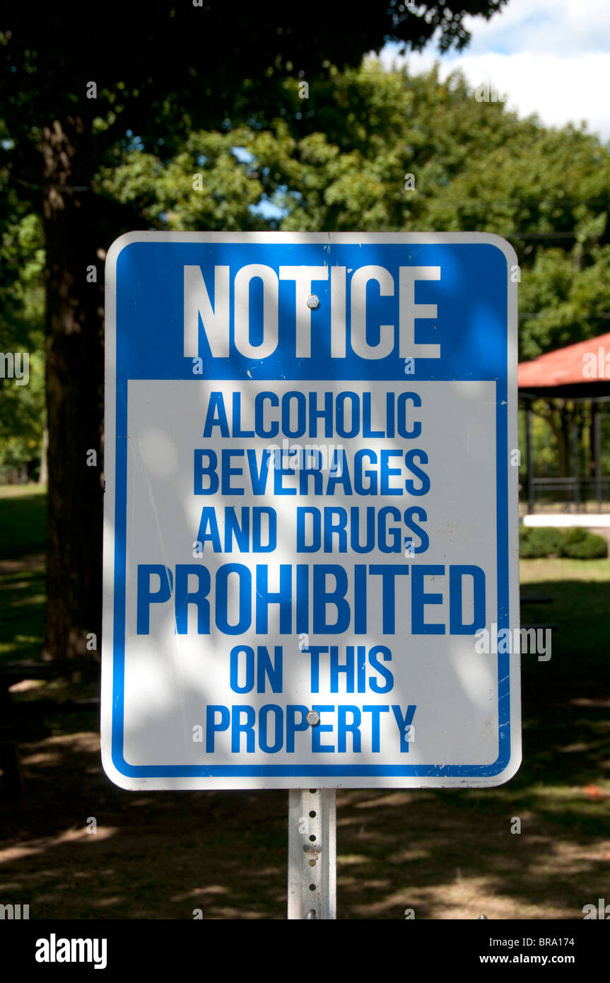 Warning sign in city park Stock Photo - Alamy