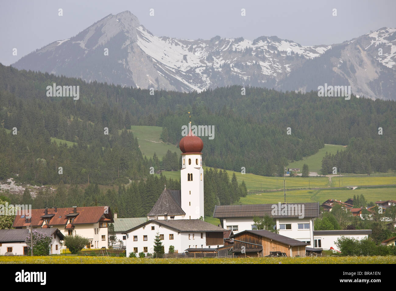 Austria, Lechtaler Alps, Heiterwang. Village view with Austrian Alps ...