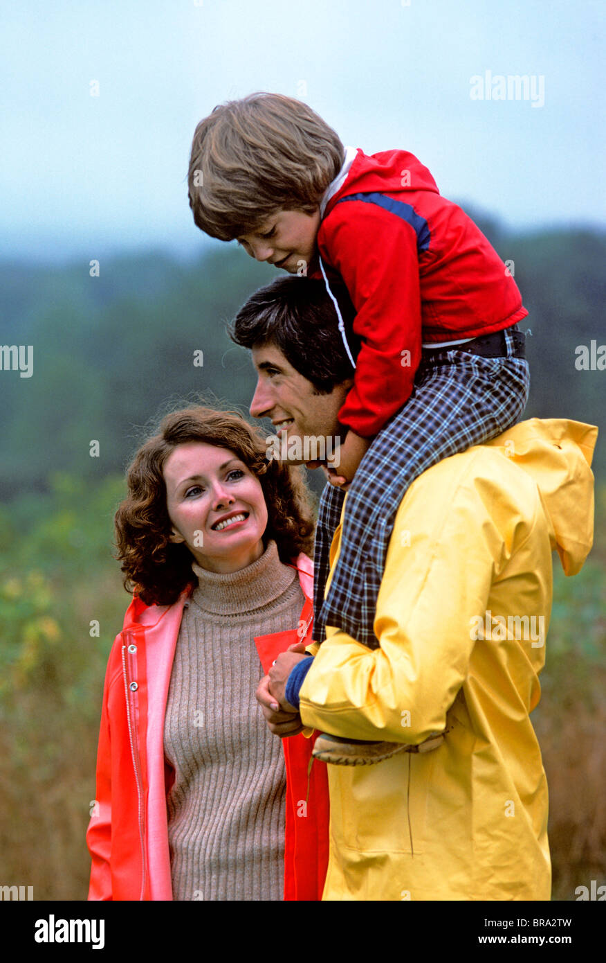 1970 1970s RETRO PARENTS MOTHER FATHER HOLDING SON ON SHOULDERS SMILING ...