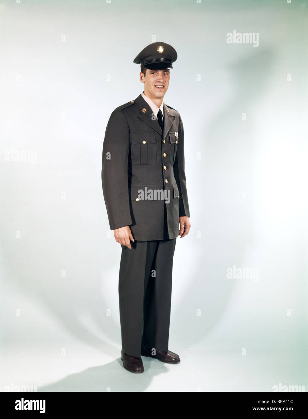 1960s FULL LENGTH PORTRAIT STANDING SOLDIER SMILING ARMY UNIFORM Stock ...