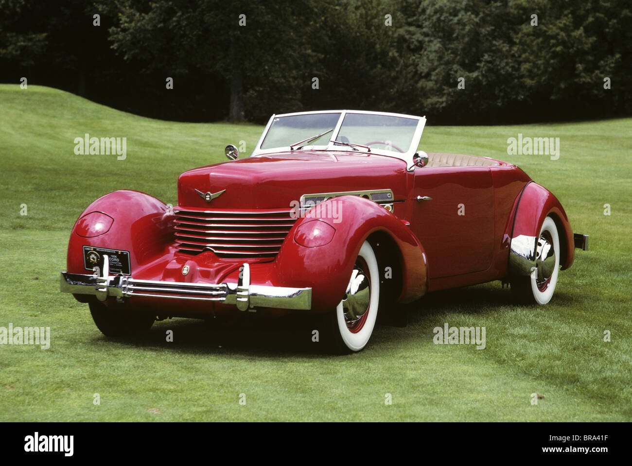 1930s 1936 RED CORD CONVERTIBLE AUTOMOBILE TOP DOWN ON GREEN GRASSY ...