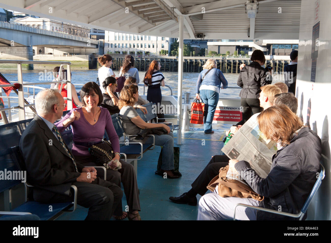 Thames clipper boat passengers hi-res stock photography and images - Alamy