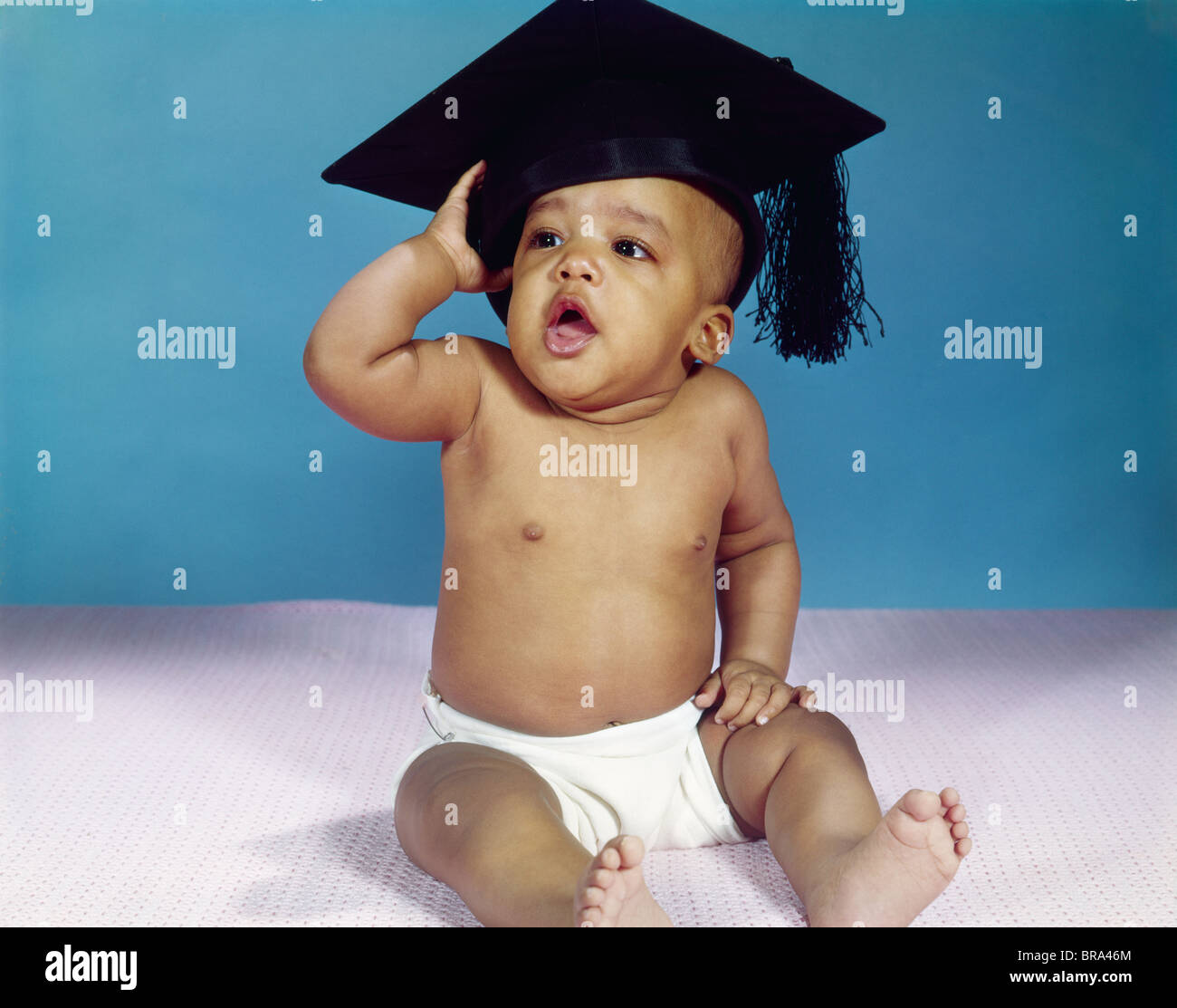 1960s AFRICAN-AMERICAN BABY WEARING DIAPER AND GRADUATION CAP ...