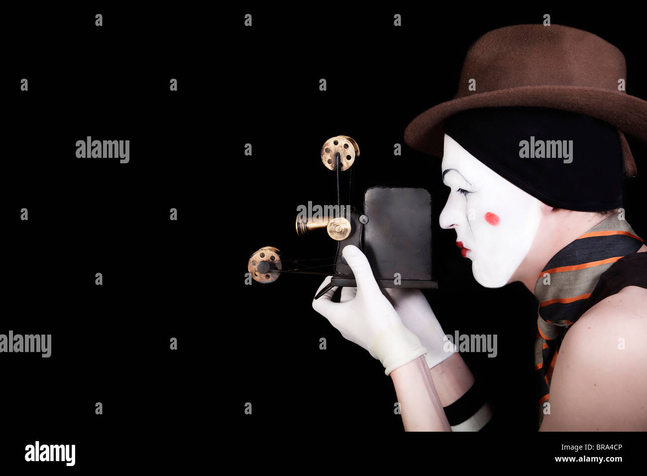 portrait of mime in white gloves and brown hat with camera Stock Photo ...