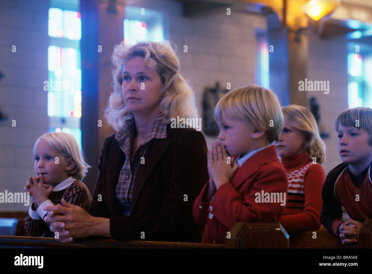 Child prays in church hi-res stock photography and images - Alamy