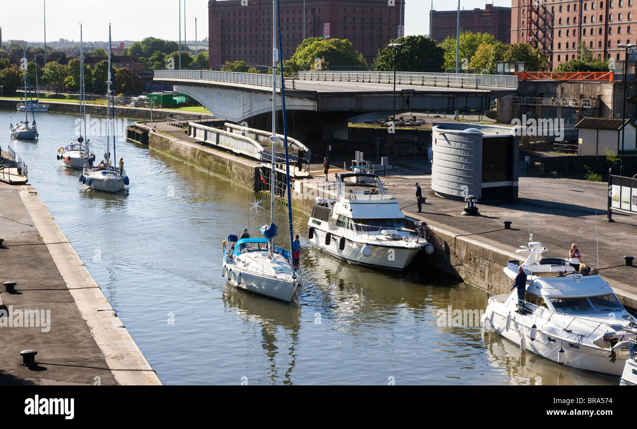 Sailing boats enter the Brunel lock from the Cumberland basin Bristol ...