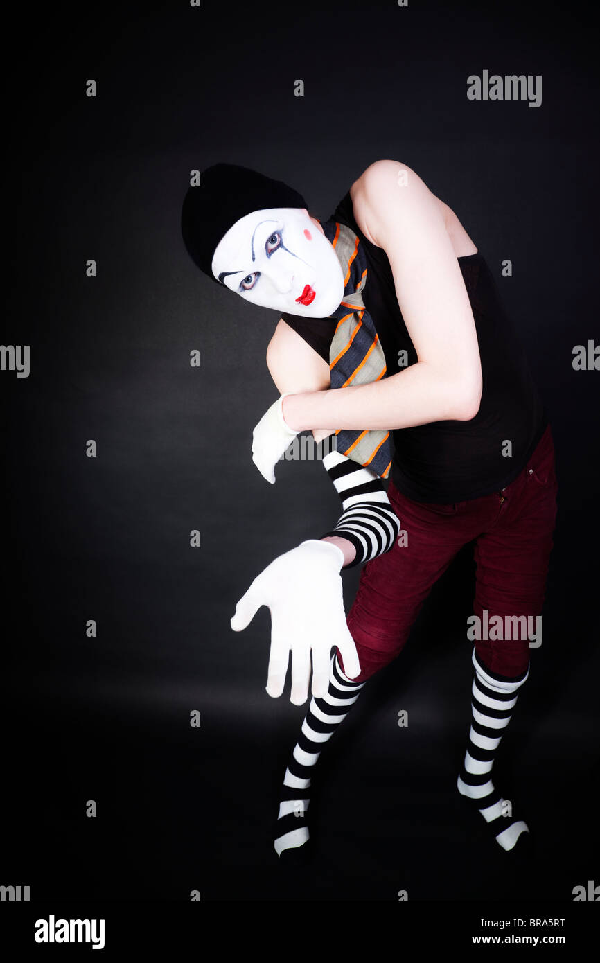 Funny mime in white gloves on black background Stock Photo - Alamy