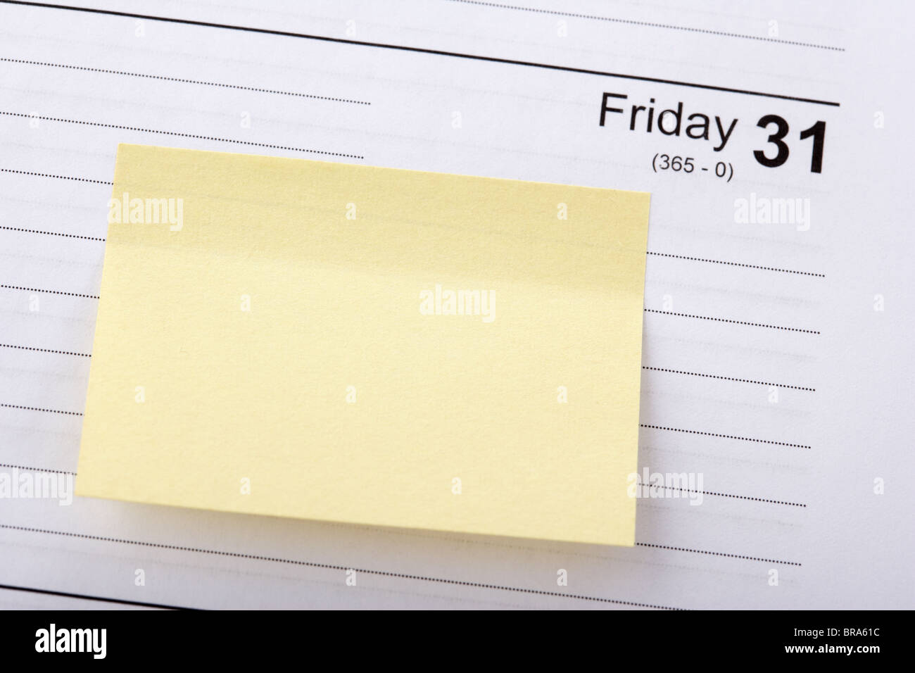 blank post-it note stuck into a diary at the end of the month Stock ...