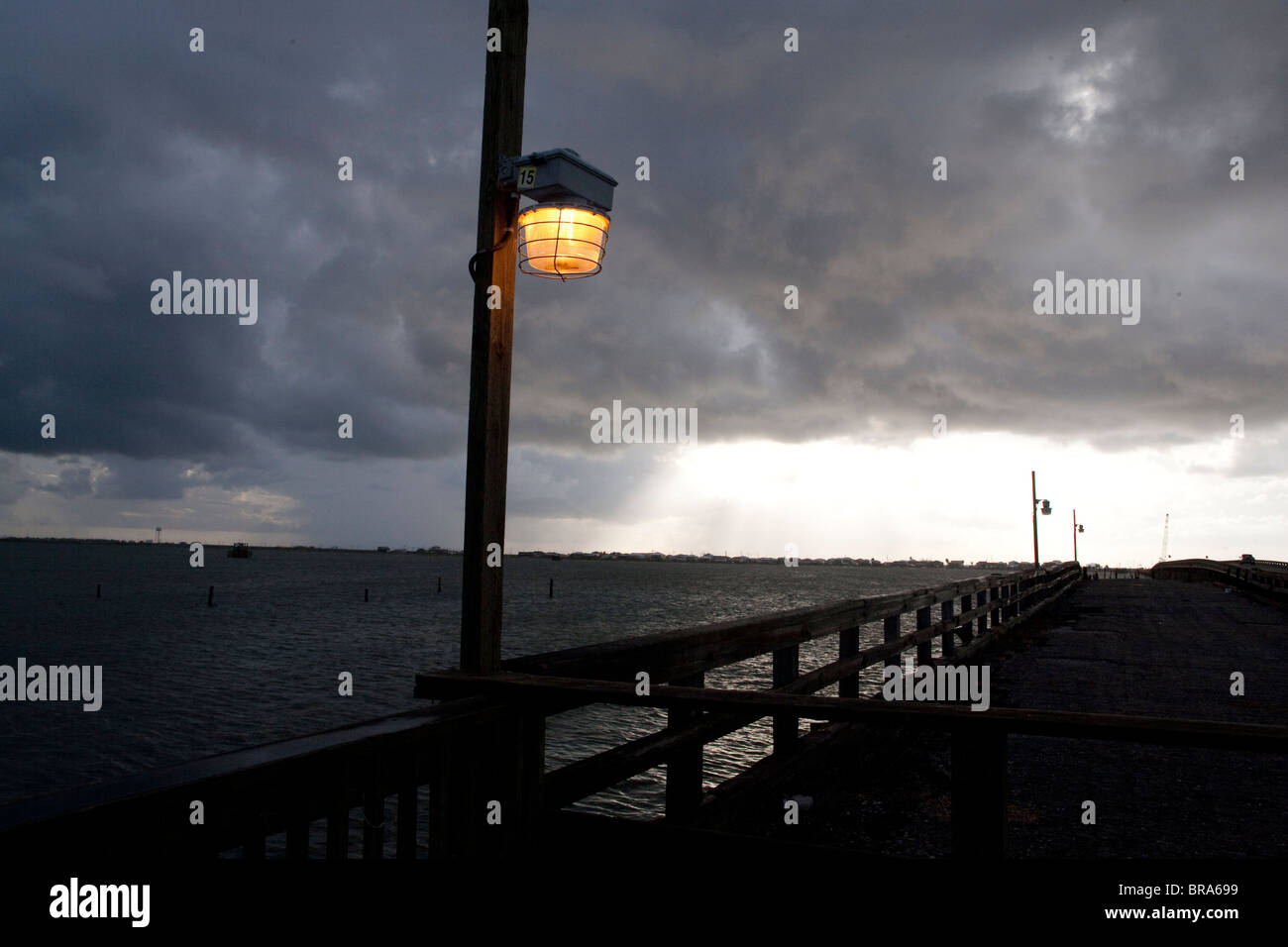 A dramatic sunset over the fishing pier at Grand Isle, Louisiana Stock ...