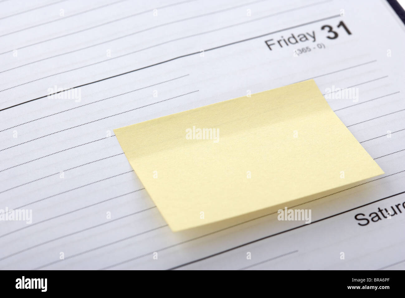 blank post-it note stuck into a diary at the end of the month Stock ...