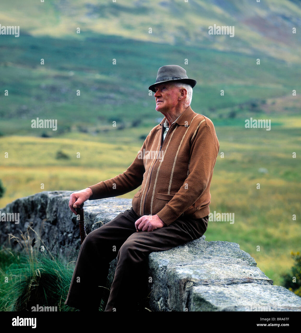 Ireland; Man Sitting On A Bridge Stock Photo - Alamy