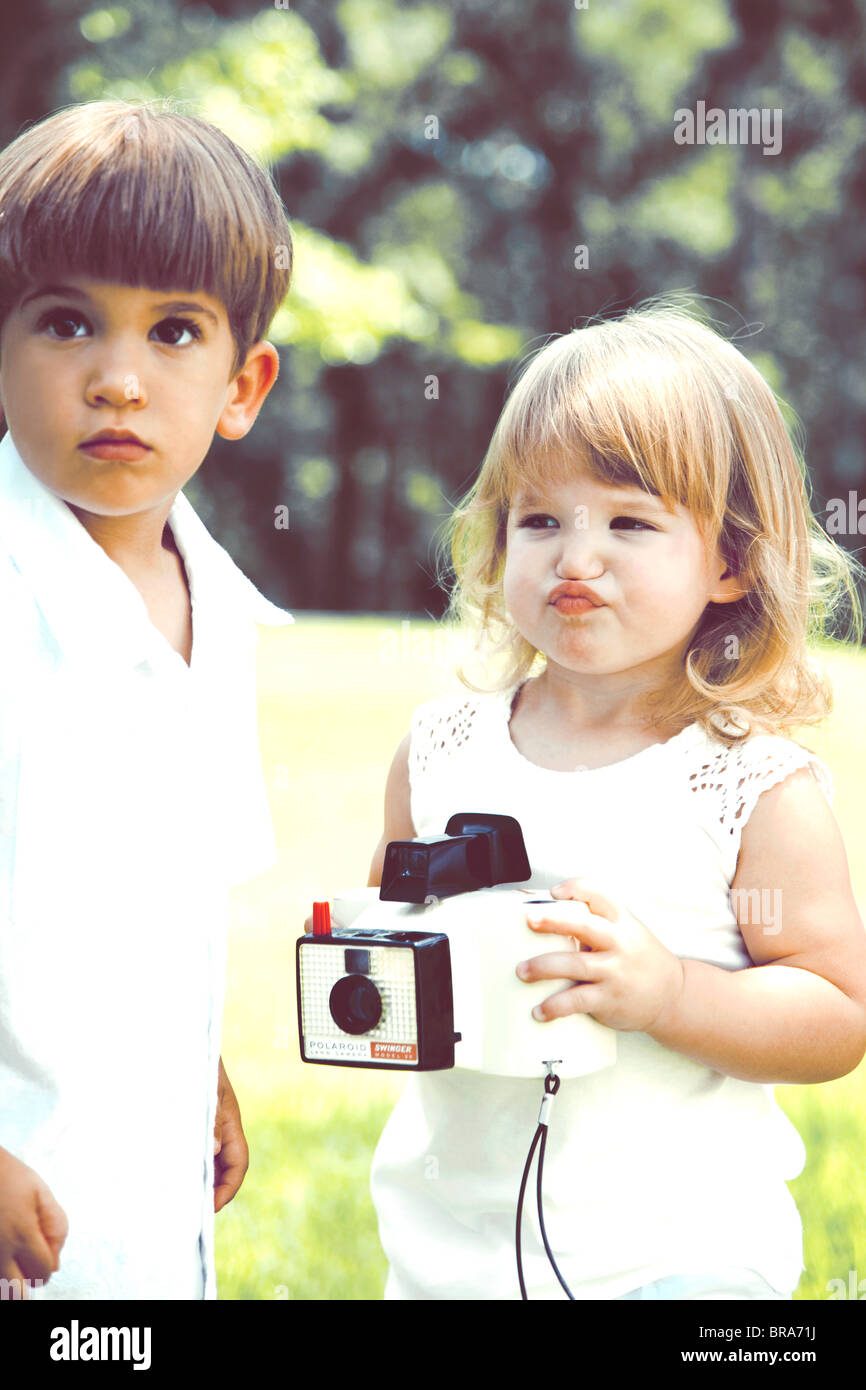 Young kids playing with a camera Stock Photo - Alamy