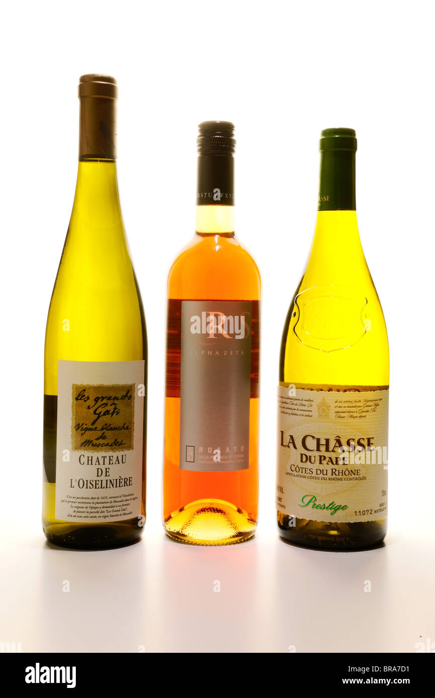 Three bottles of white wine against a white high key background Stock ...
